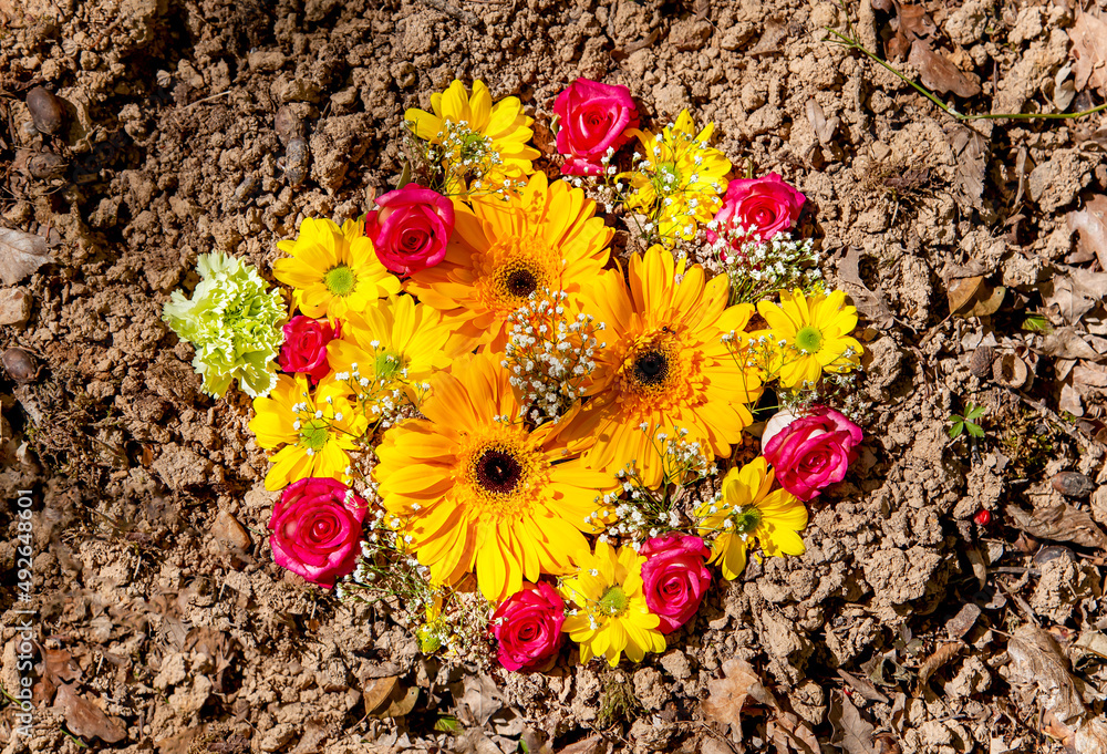 flowers in the forest. Funeral Roses, sunflowers and Carnations flowers ...