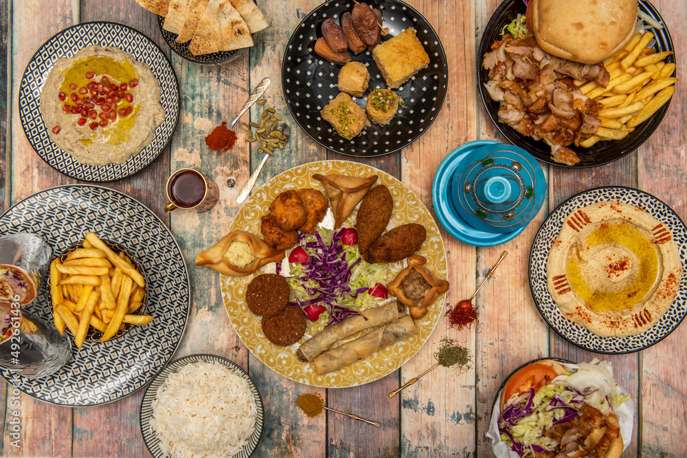 Asian food and kebab dishes set, basmati rice, falafel, durum, hummus ...