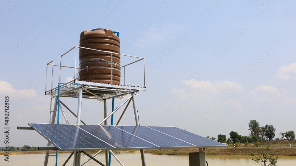 Water tanks and solar panels. A water reserve system with photovoltaic ...