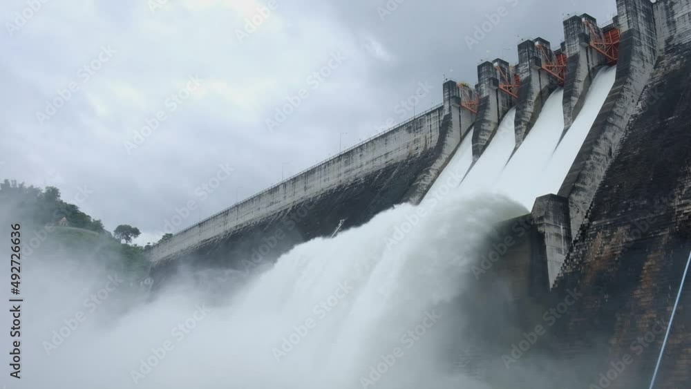A large dam is draining because of heavy rain. The amount of water in ...