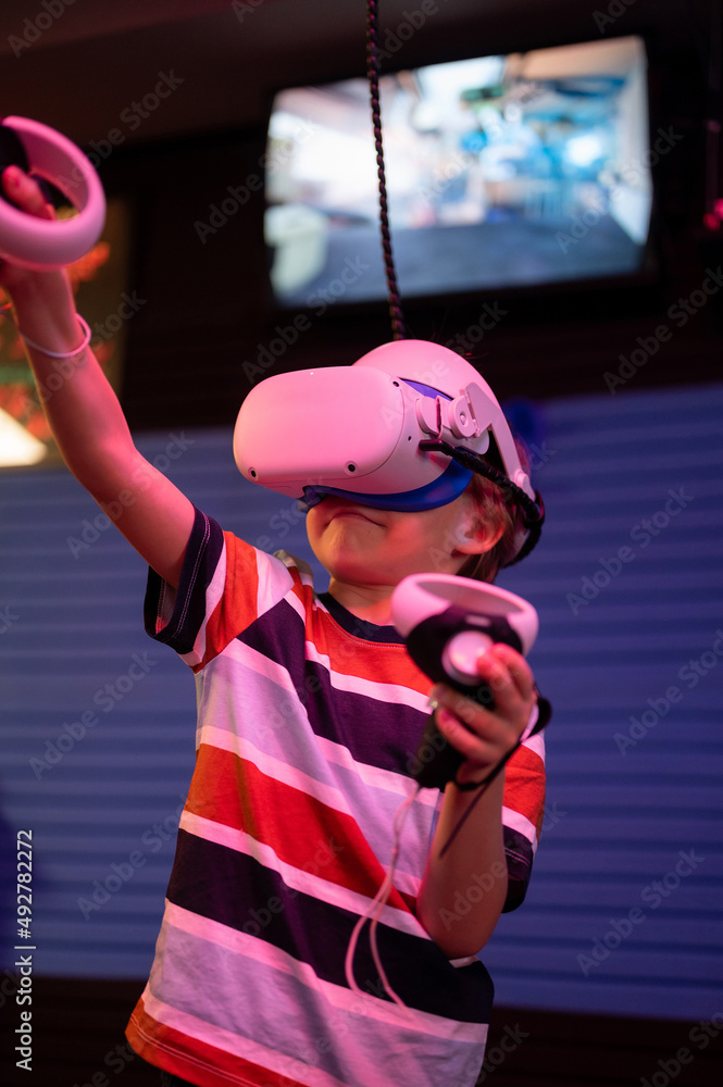 vr game and virtual reality. kid boy gamer six years old fun playing on ...