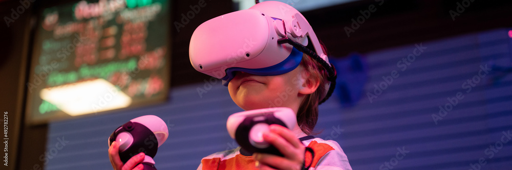 vr game and virtual reality. kid boy gamer six years old fun playing on ...