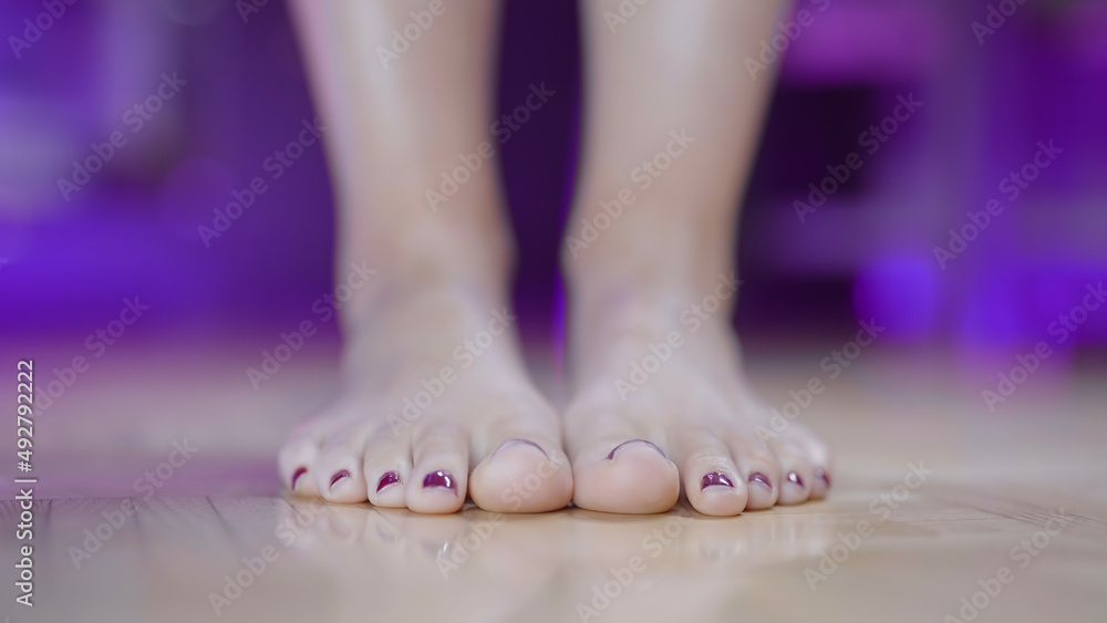 Cute female barefoot feet with polished purple toenails Stock Photo ...