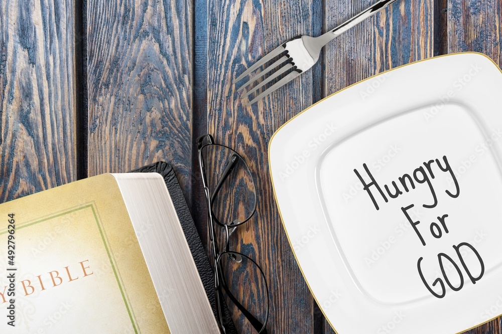 Fasting and prayer. Christian biblical concept, empty plate with Holy ...