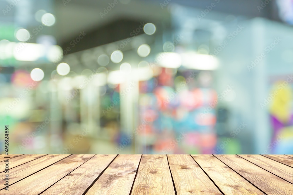 Wood table top with supermarket grocery store background for product ...