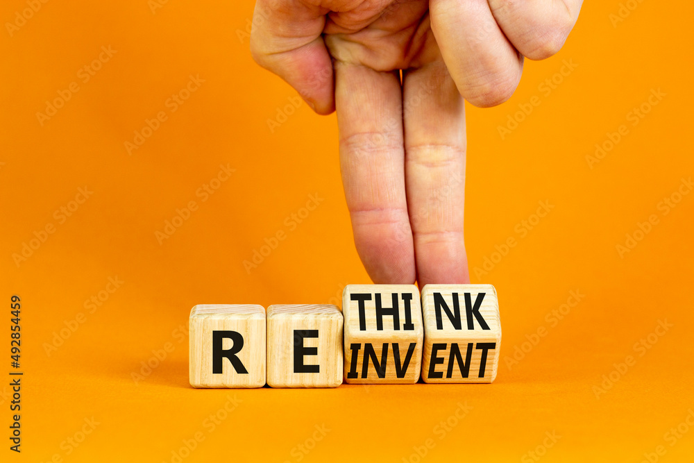 Reinvent and rethink symbol. Businessman turns cubes and changes the ...
