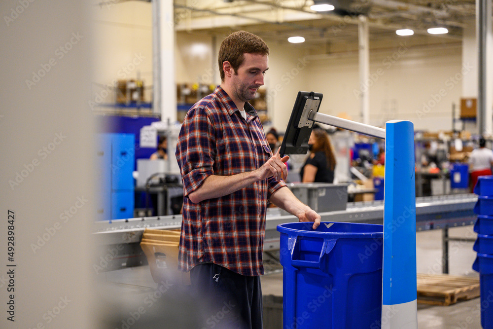 Computer tablet in use at factory Stock Photo | Adobe Stock