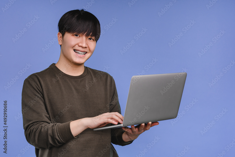 Happy asian korean young coder programmer student man freelancer hacker ...