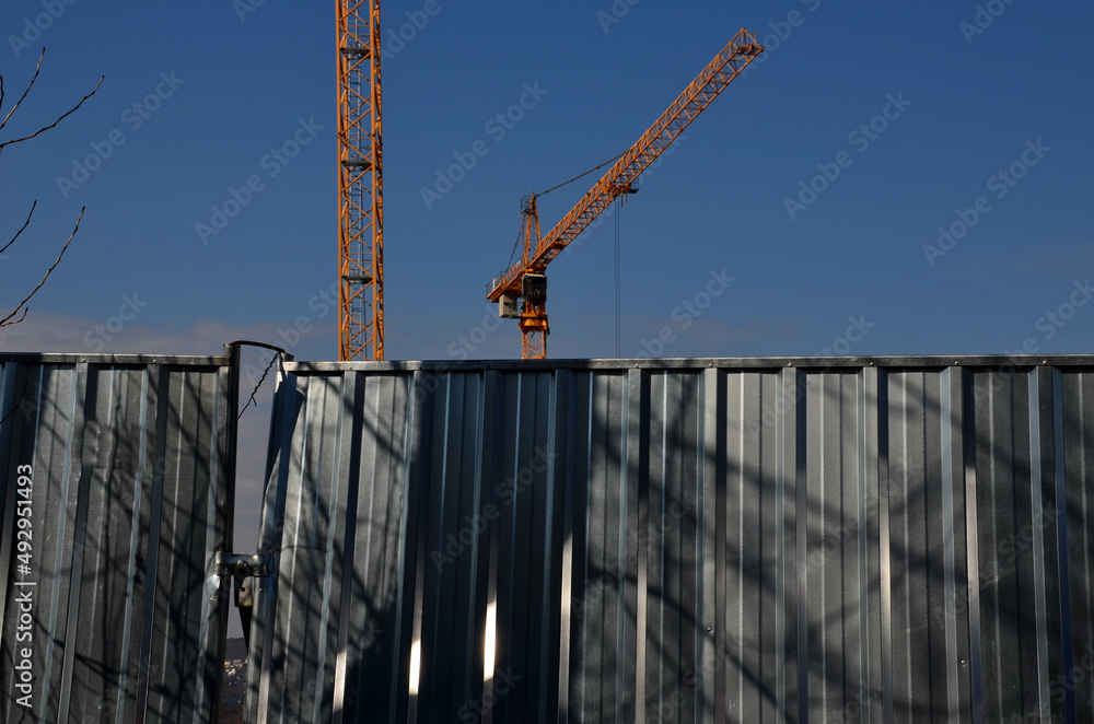 metal shiny galvanized portable fences delimit the construction site ...