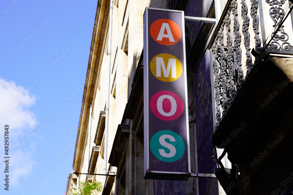 AMOS sign logo text and brand sign on store solidarity movement ...