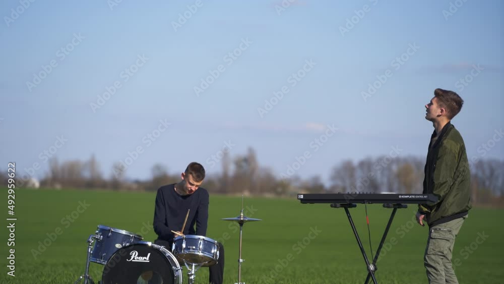 Guys playing musical instruments in the beautiful green plantations ...