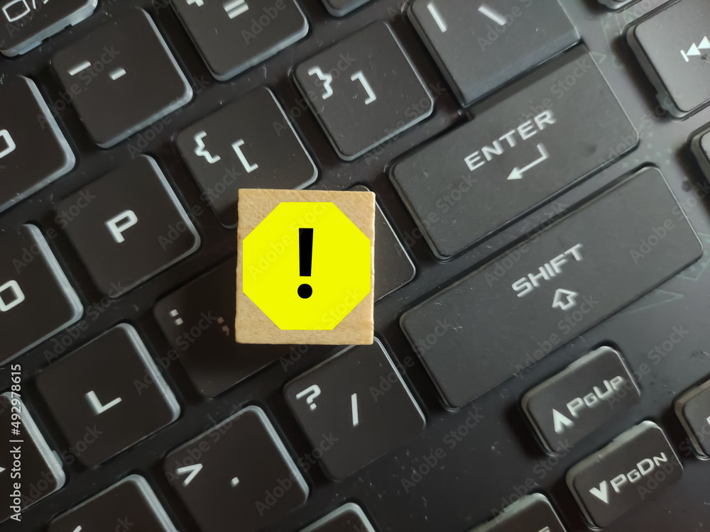 Display of warning sign symbols on the keyboard. Stock Photo | Adobe Stock