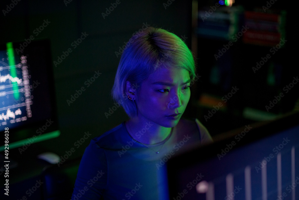 Asian female computer hacker in a futuristic style Stock Photo | Adobe ...