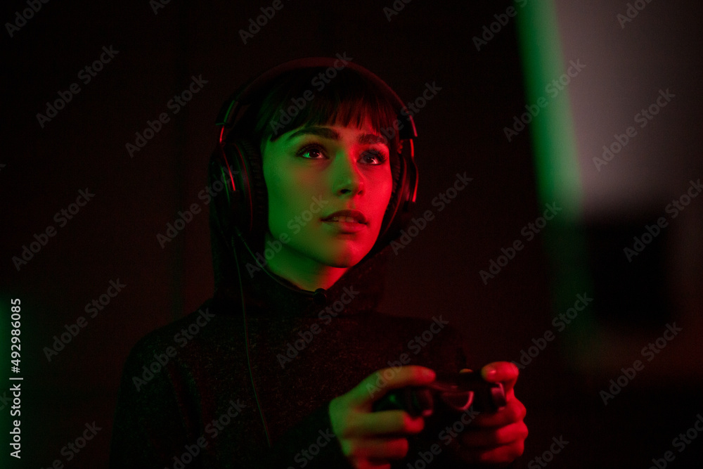 Female Gen Z gamer using a video game console Stock Photo | Adobe Stock