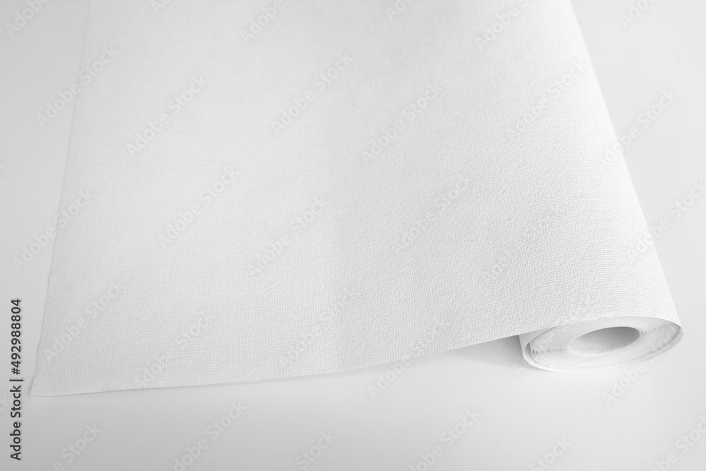Rolled sheet of white textured wallpaper, on white background ...