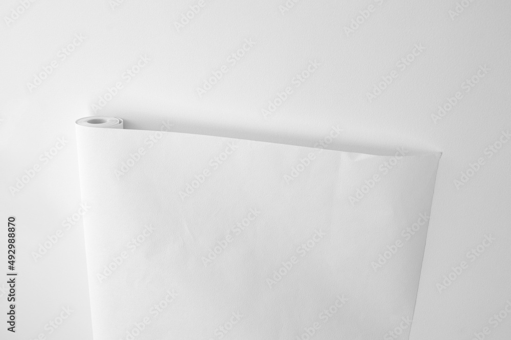 Rolled sheet of white textured wallpaper, on white background ...