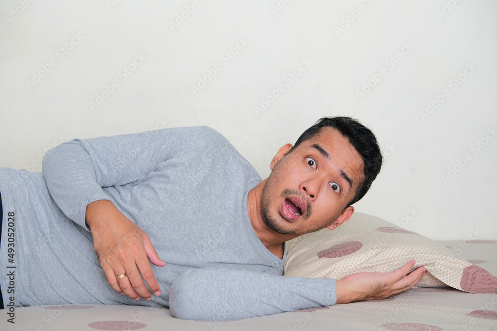 Side view of Adult Asian man wake up with shocked face expression Stock ...