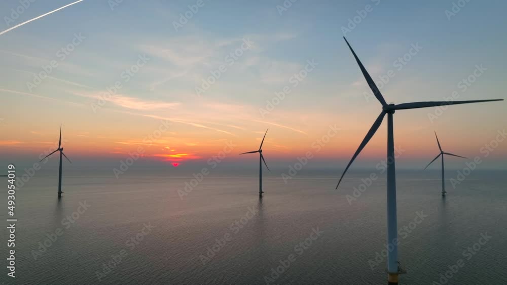 Wind turbines producing sustainable renewable energy in an offshore ...