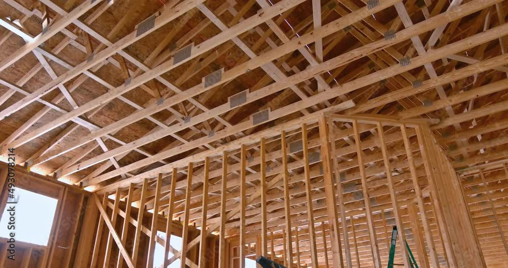 Standard timber roof frame of wooden rafters beams an interior view ...