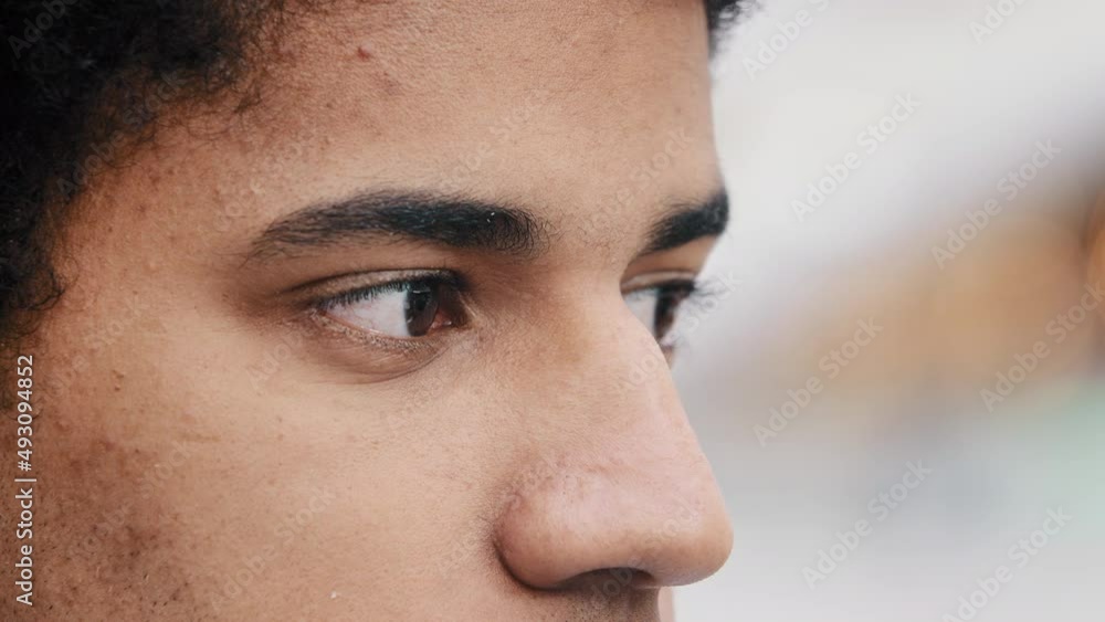 Side view close-up male sad face in profile detail eyes african ...