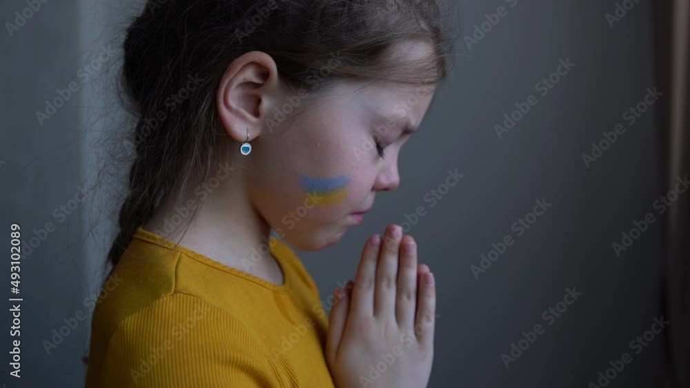 Upset Ukrainian girl kid crying protesting war conflict. Crisis, peace ...