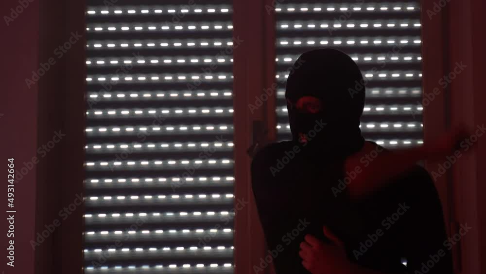 Cinematographic scene of cruel psycho killer with hidden face under the ...