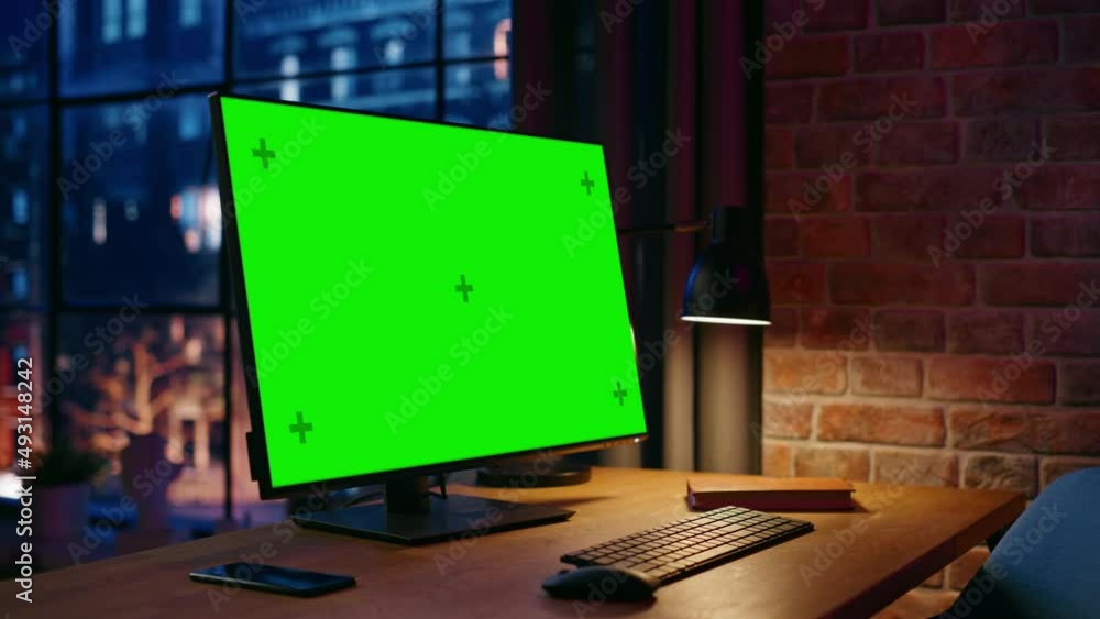 Desktop Computer Monitor Standing on a Table with a Green Screen ...