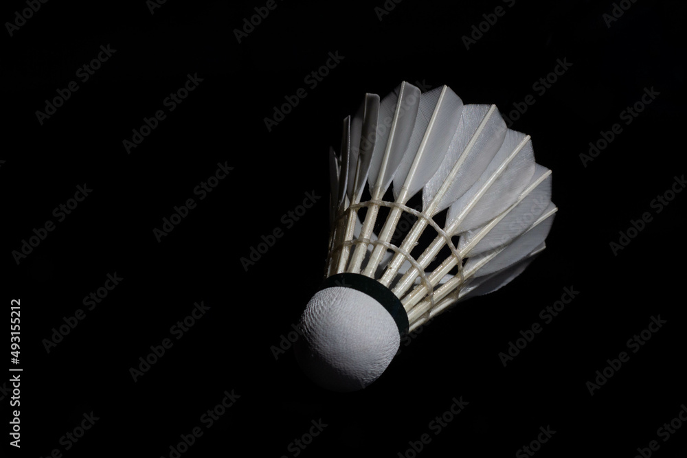 badminton ball floating in black background badminton ball used in ...