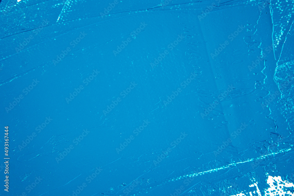 saturated blue abstract background, applied toning primer on a white ...