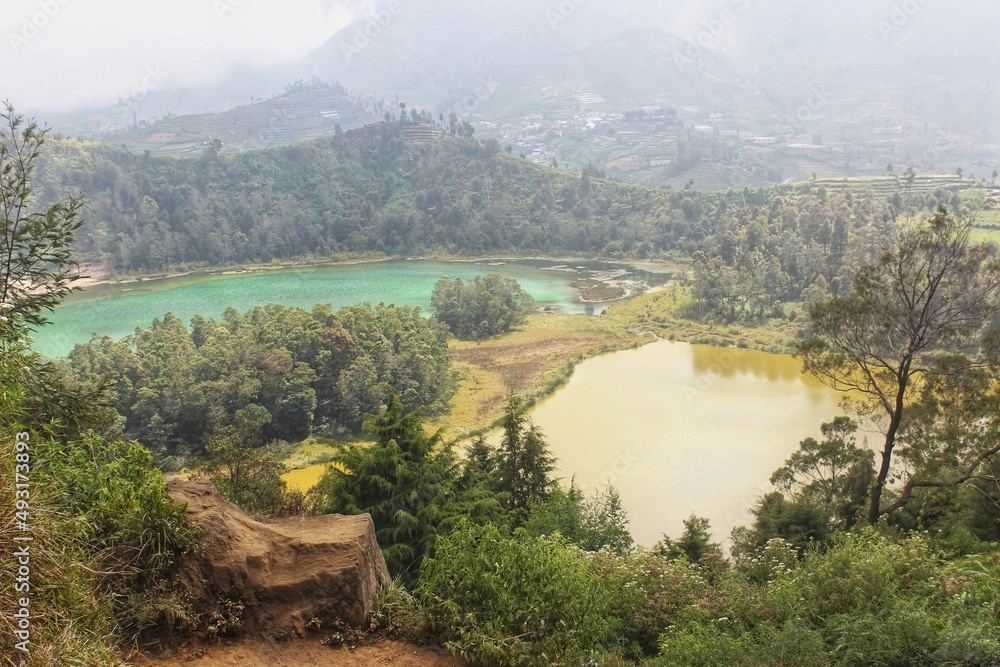 Telaga Warna or Colors Lake, is a famous destination lake because there ...