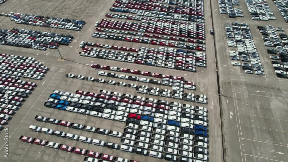 Aerial.new car storage parking lot showing imported new vehicles or ...