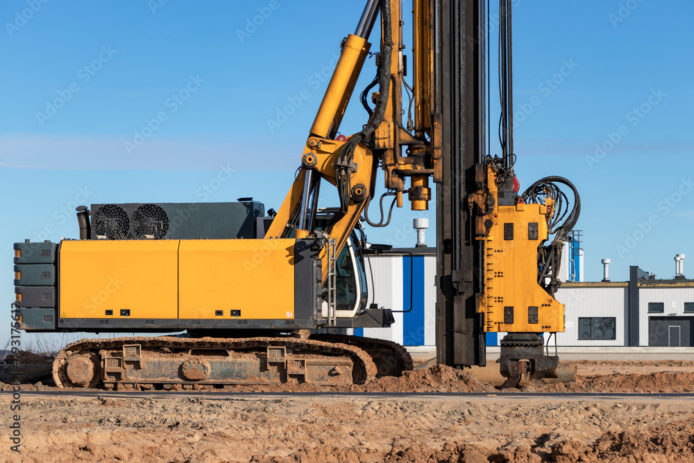 Powerful hydraulic drilling rig at a construction site. The device of ...