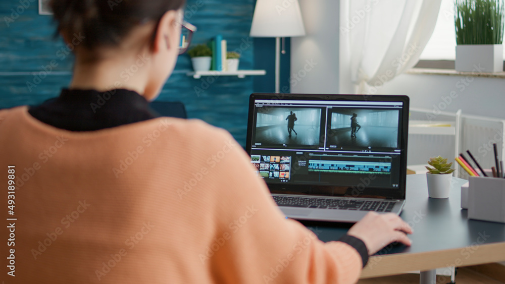 Foto de Content creator using video editing software to design montage ...