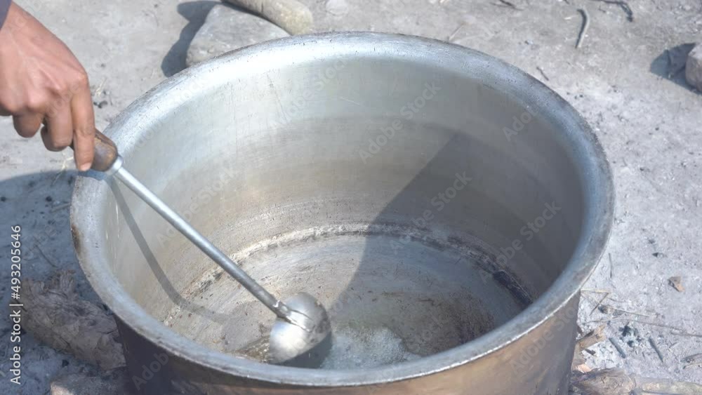 Vidéo Stock Indian traditional way of making food in big utensil at ...