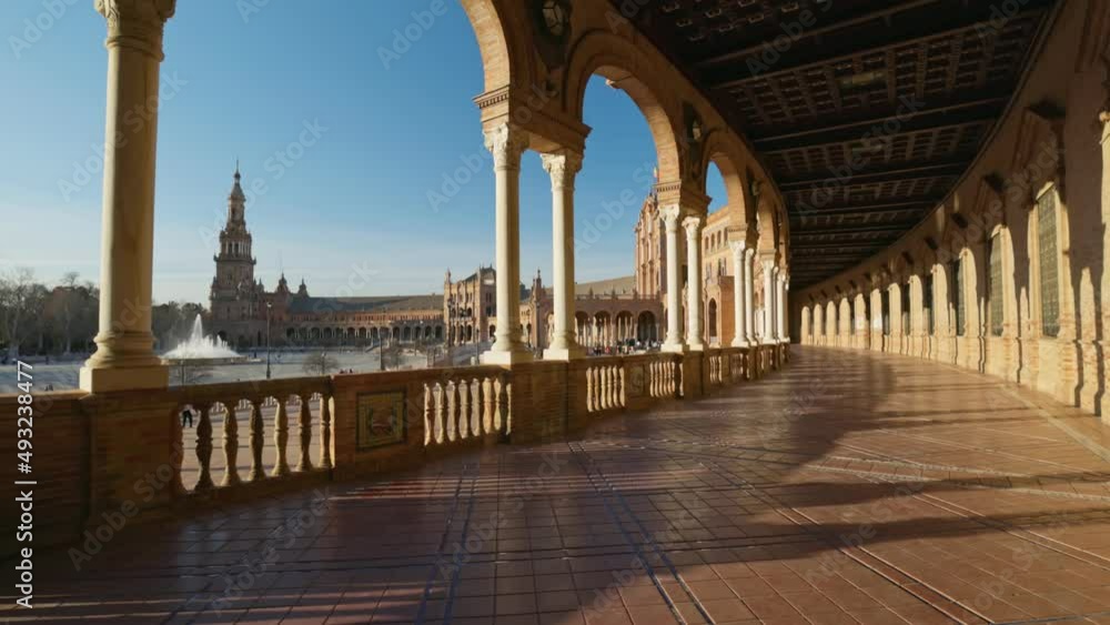 Camera moves along the corridor with columns in Plaza de Espana ...