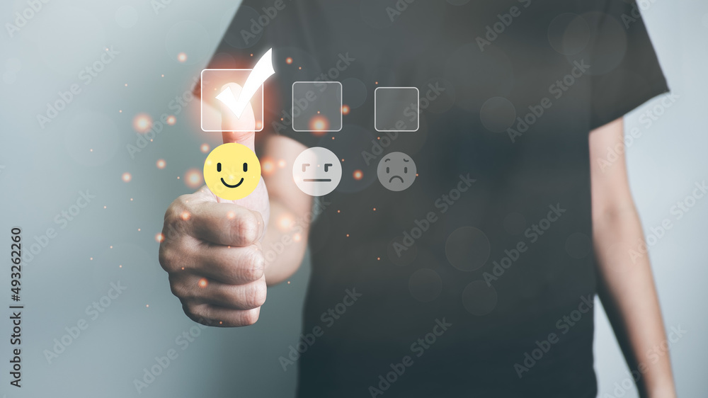 Customer satisfaction concept, thumbs up rating on smiley face icon ...