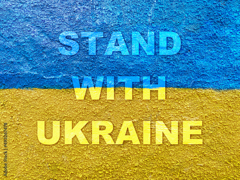 Stand with Ukraine message on Ukrainian flag painted on wall Stock ...