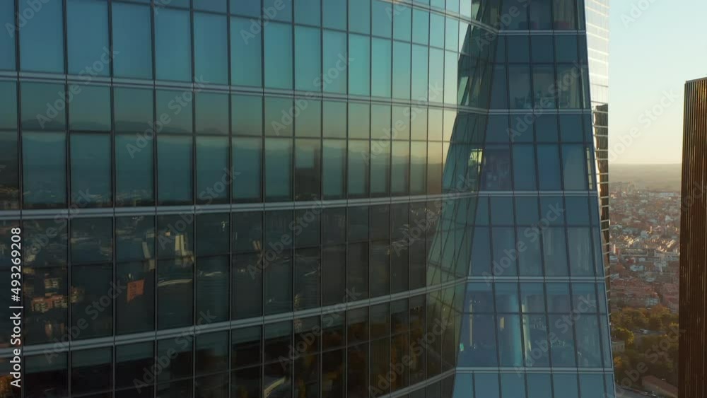 Ascending footage along windows and glass wall of office skyscraper ...