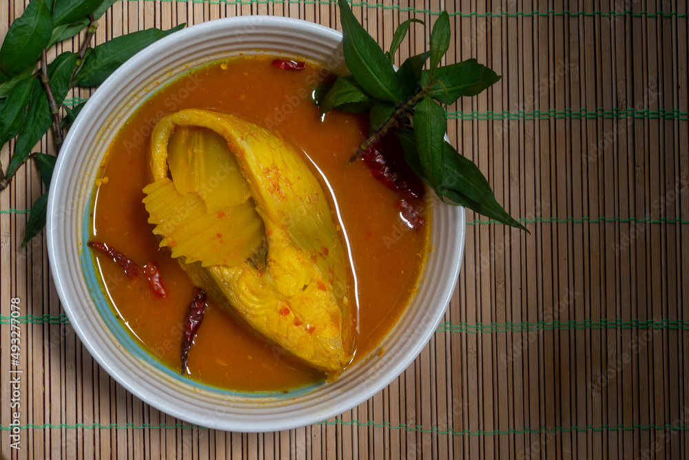 Southern Thai Gaeng Som - Red Tilapia fish soup with papaya Stock Photo ...