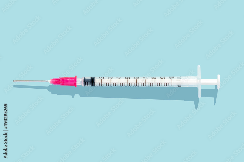 injection syringes. Top view and blue background. Disposable medical ...