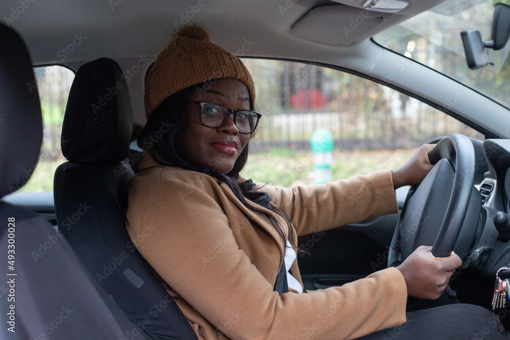 taxi driver, portrait of black woman driving a car Stock Photo | Adobe ...