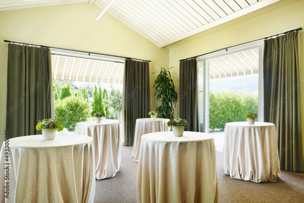 Wedding reception meeting room with tall tables Stock Photo | Adobe Stock