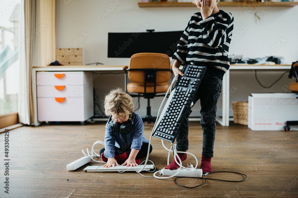 Children playing with electronic equipment Stock Photo | Adobe Stock