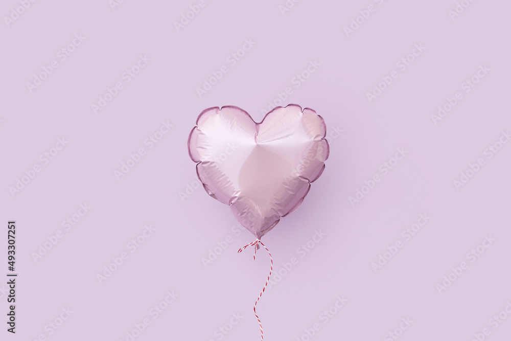 Violet balloon over the same color background Stock Photo | Adobe Stock