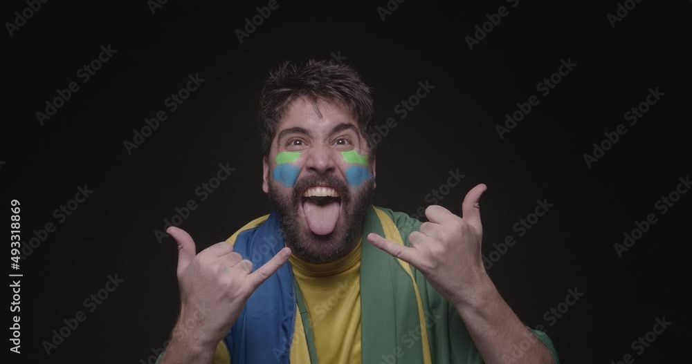 handsome man with brazilian beard, soccer fan, making expressions ...