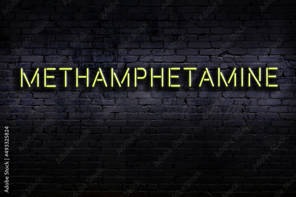 Neon sign. Word methamphetamine against brick wall. Night view Stock ...