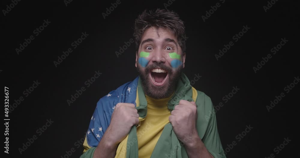 handsome man with brazilian beard, soccer fan, screaming goal. with ...