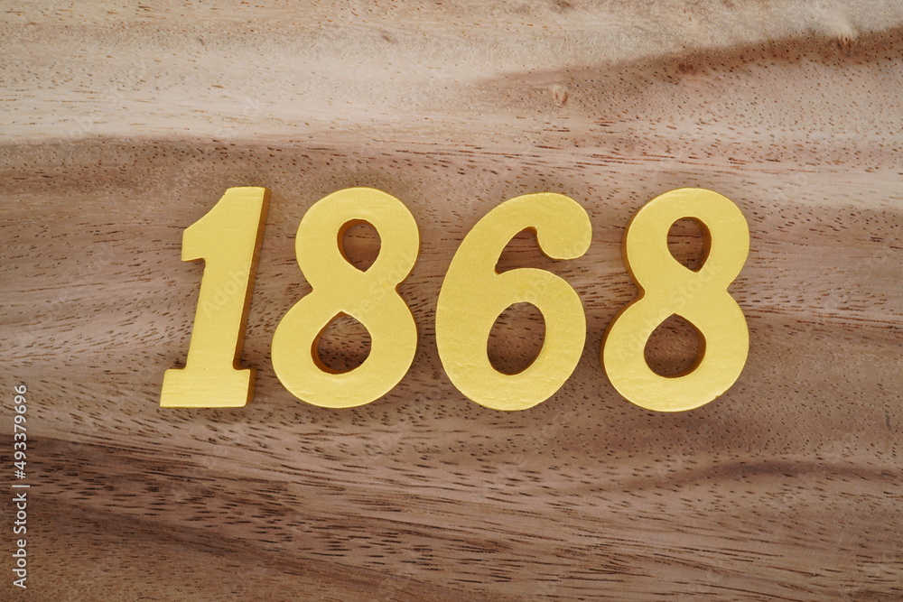 Golden Arabic numerals on a real brown and white wooden floor number ...