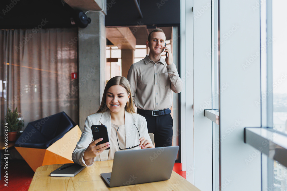 We work together on a business project. Two young business colleagues ...