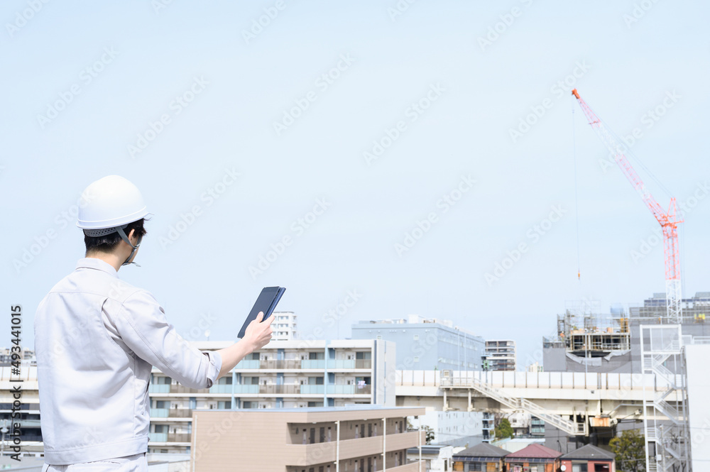 Back view of man in work clothes Wide angle Stock Photo | Adobe Stock